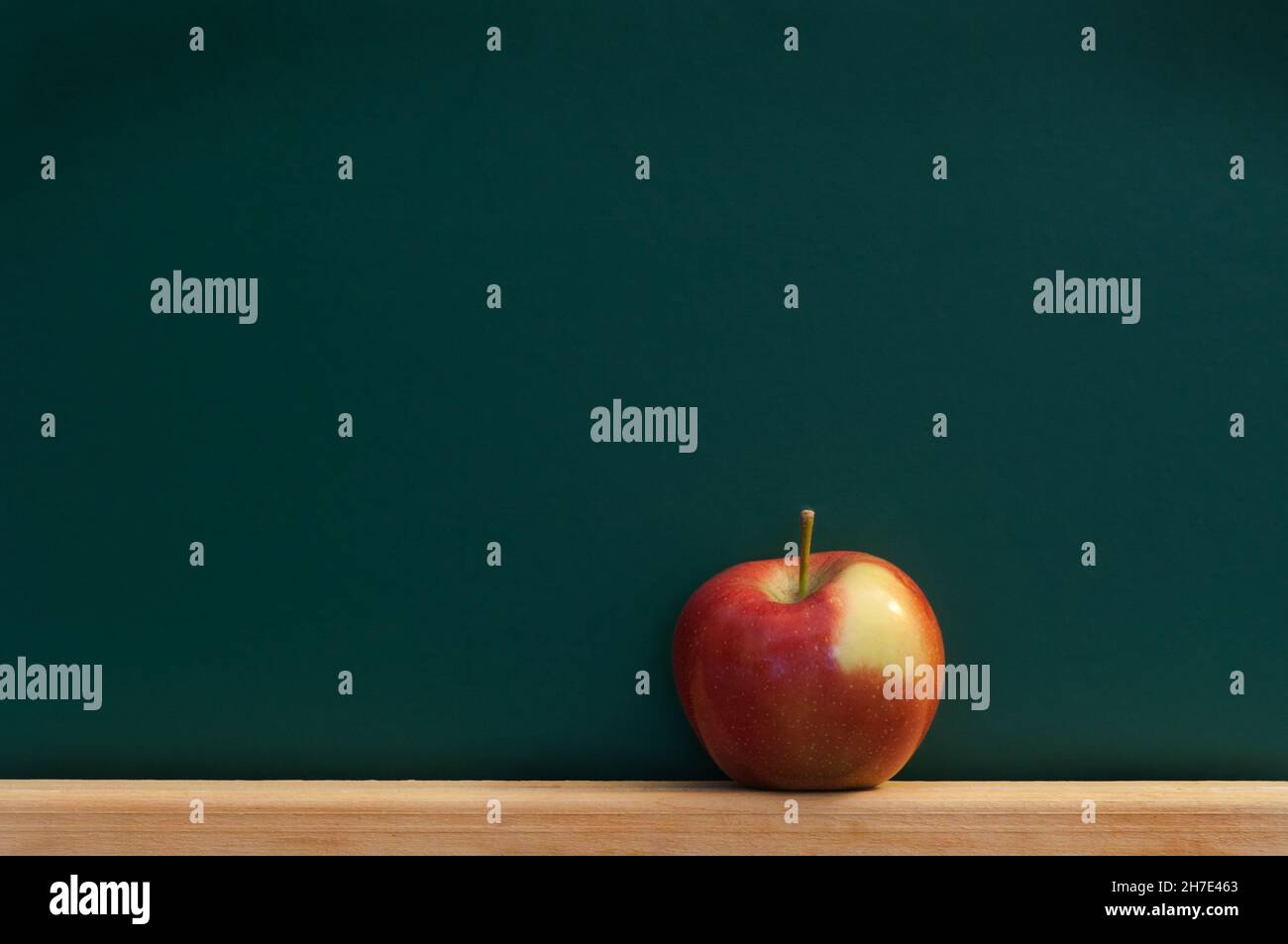 Red apple on chalkboard, add text to chalkboard Stock Photo - Alamy