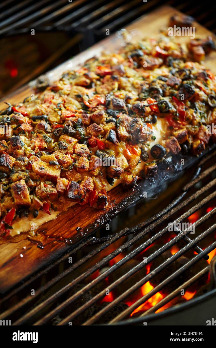 Char fillet with vegetables on a cedar wood smoking board Stock Photo ...