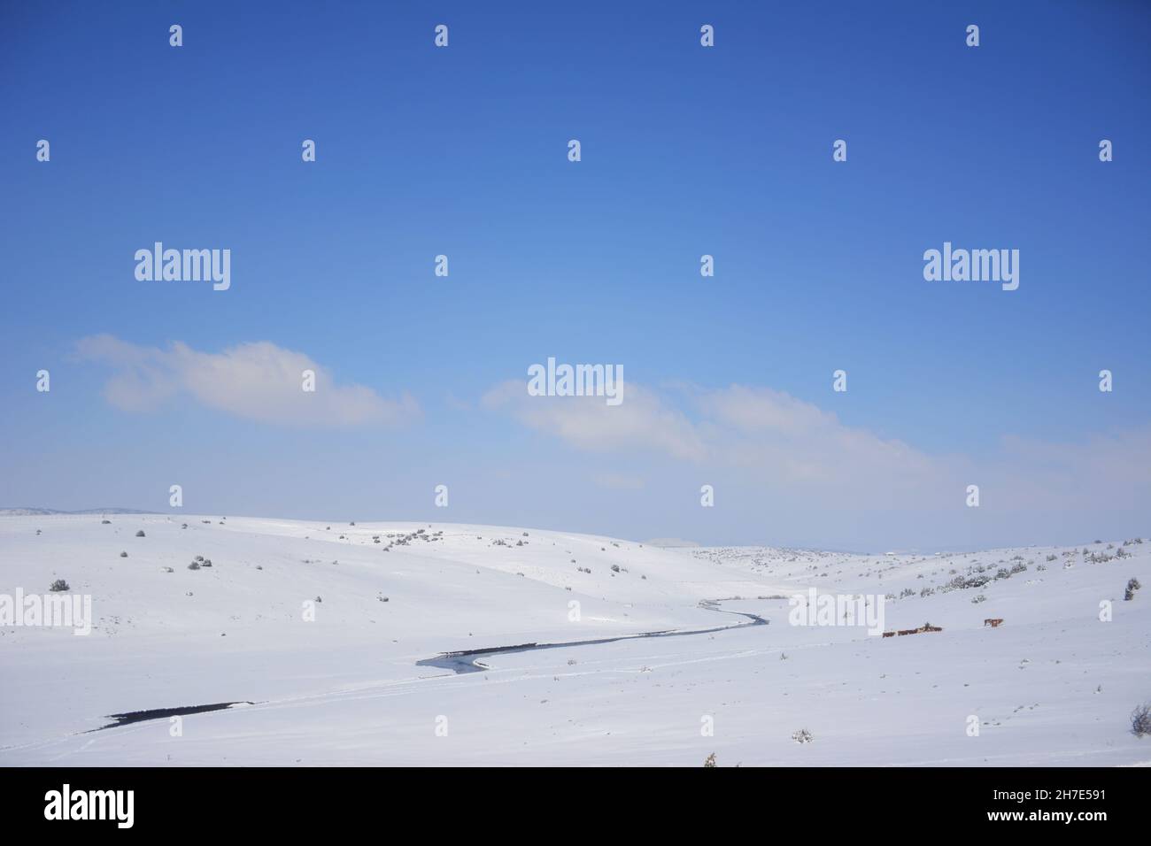 Beautiful winter landscape with snow-covered hills Stock Photo - Alamy