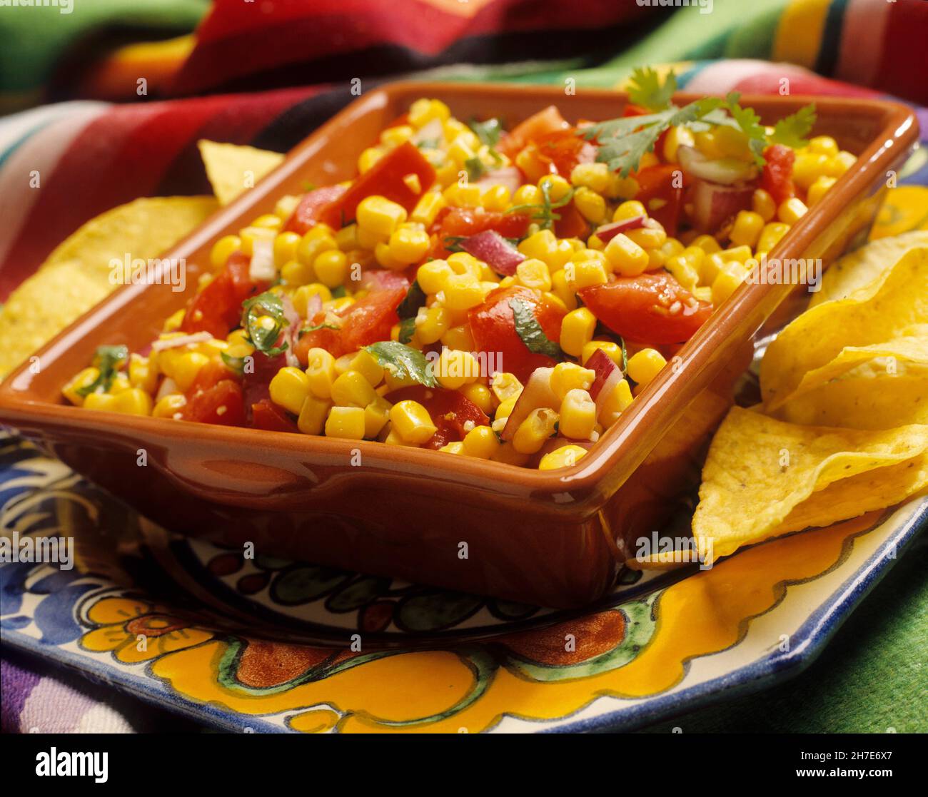 Sweetcorn salsa with Romato tomatoes and red onion (Mexico Stock Photo ...