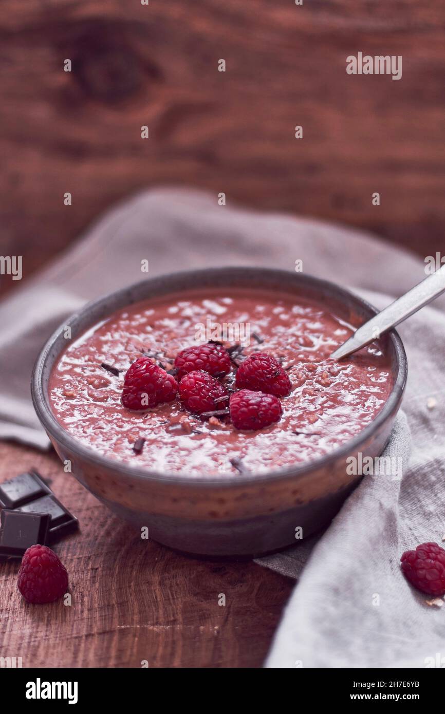 Chocolate porridge with raspberries Stock Photo - Alamy