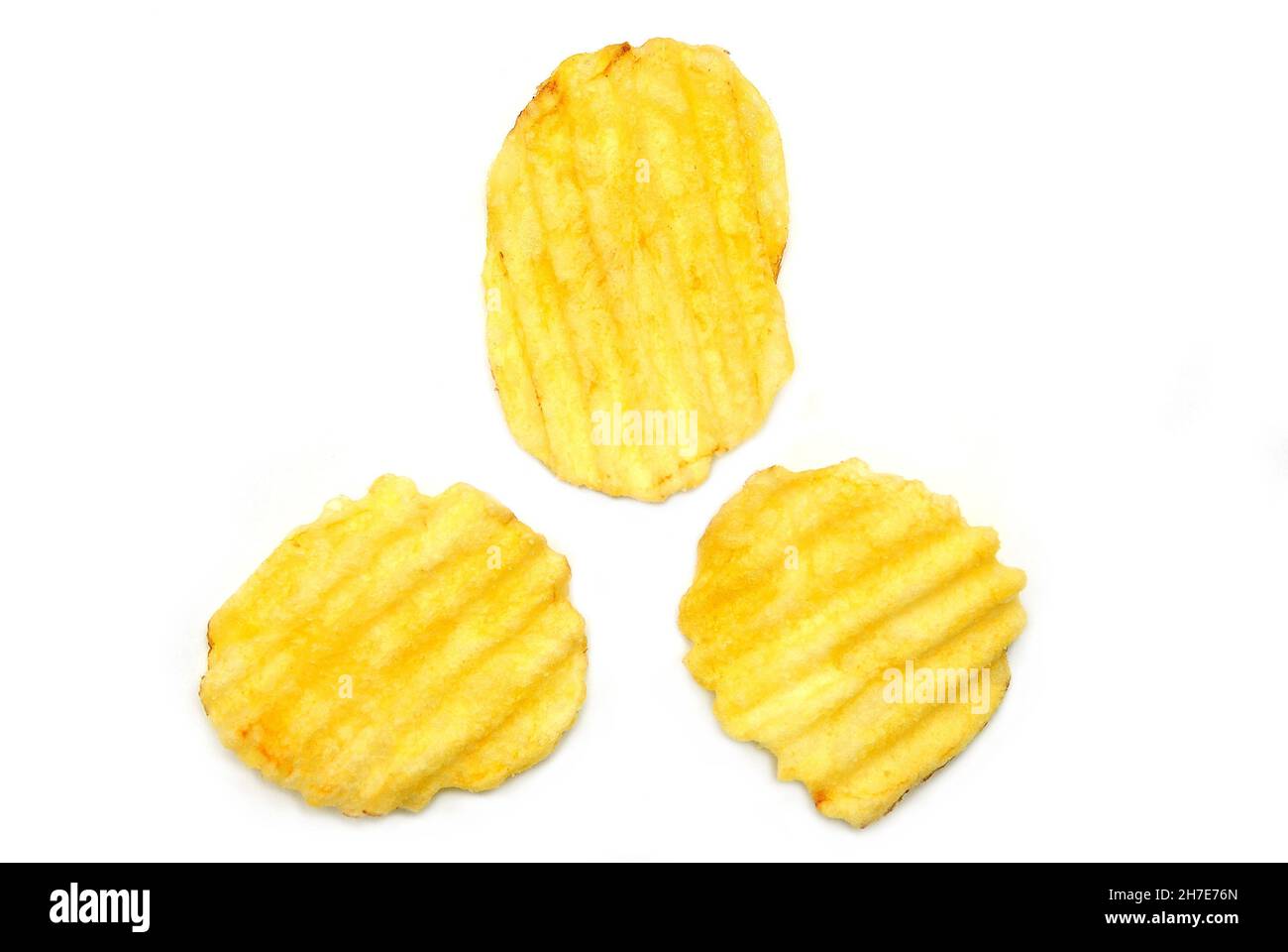 Ribbed potato chips on a white background Stock Photo - Alamy