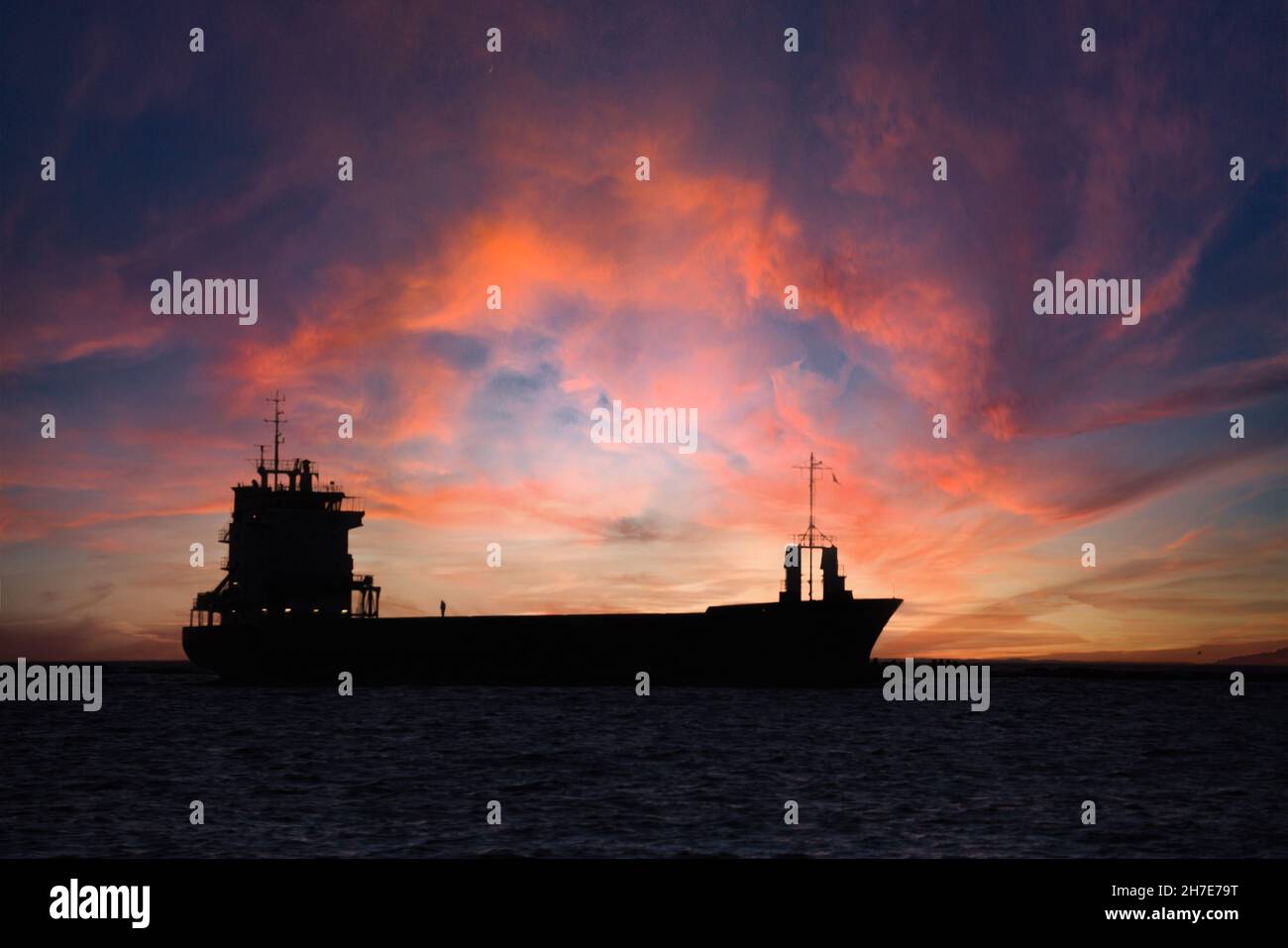 Beautiful metal ship silhouette on sea at summer evening Stock Photo ...