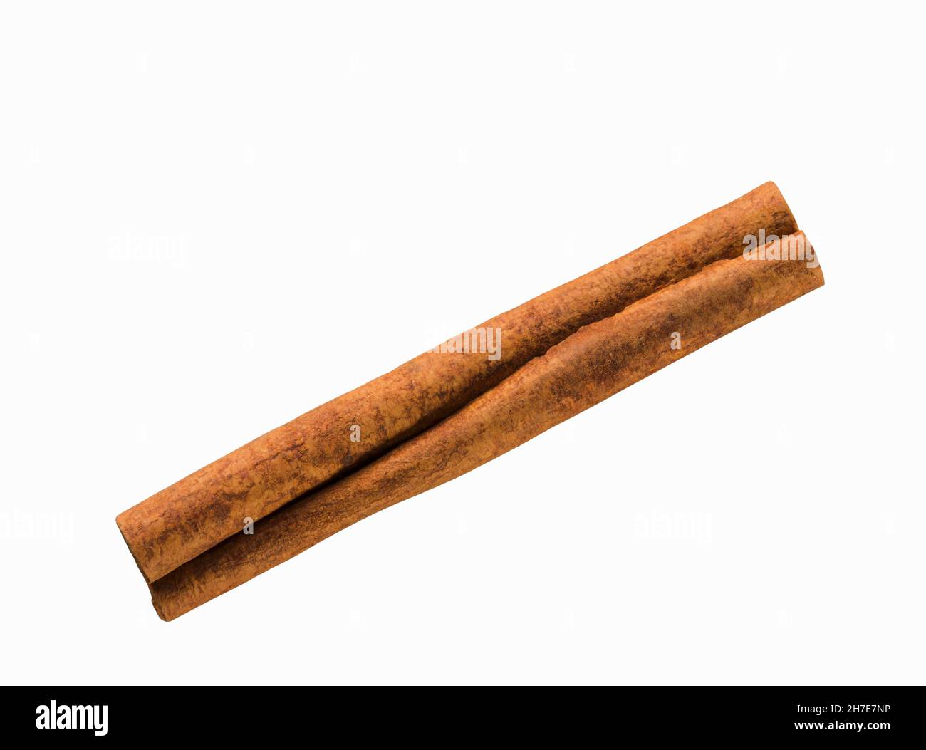 A cinnamon stick on a white surface Stock Photo - Alamy