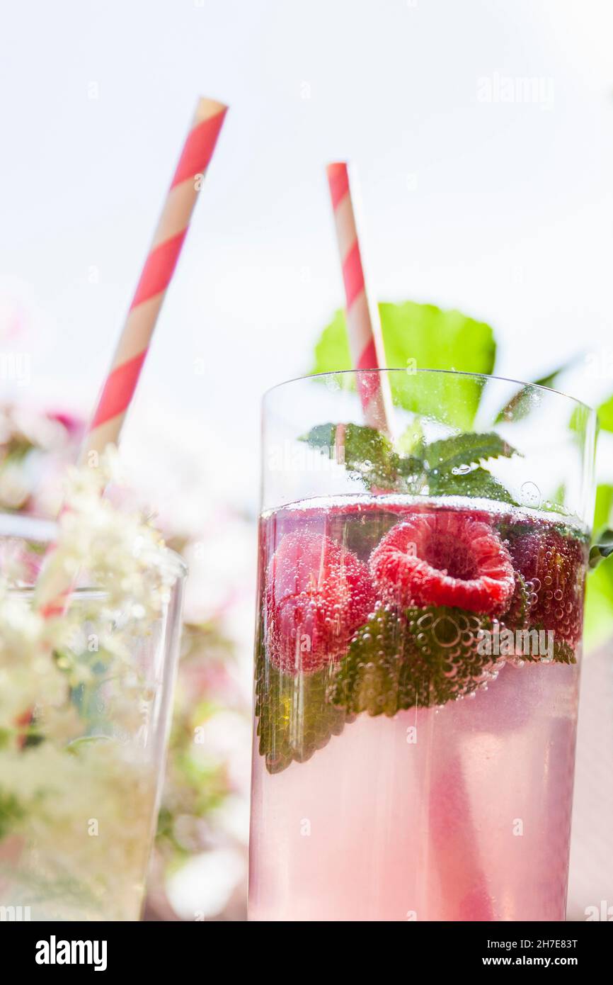 A glass of raspberry and mint infused water Stock Photo - Alamy