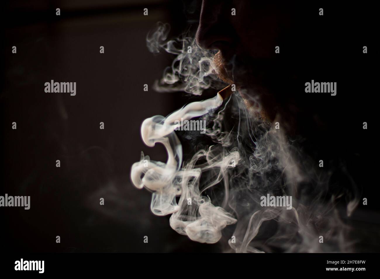 Smoke in natural light. Tobacco smoke fills the air. Clubs of steam in ...