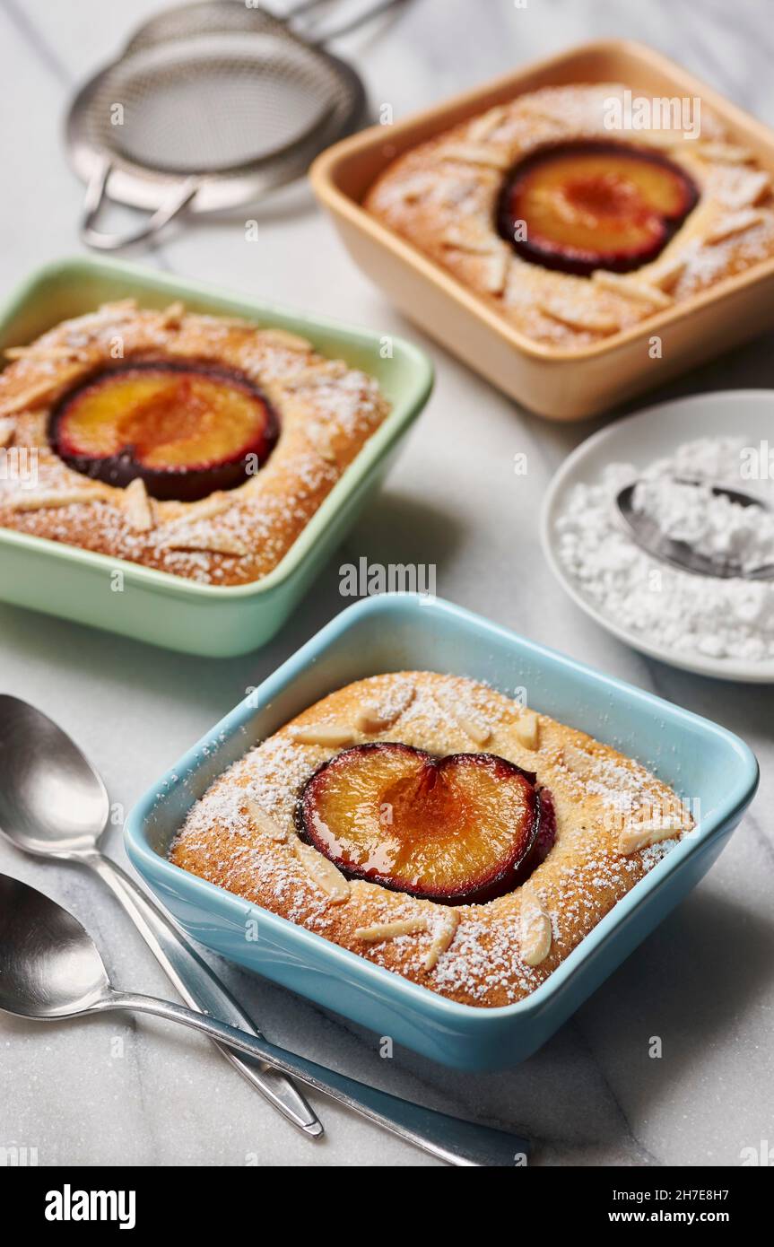 Mini puddings with plums Stock Photo - Alamy