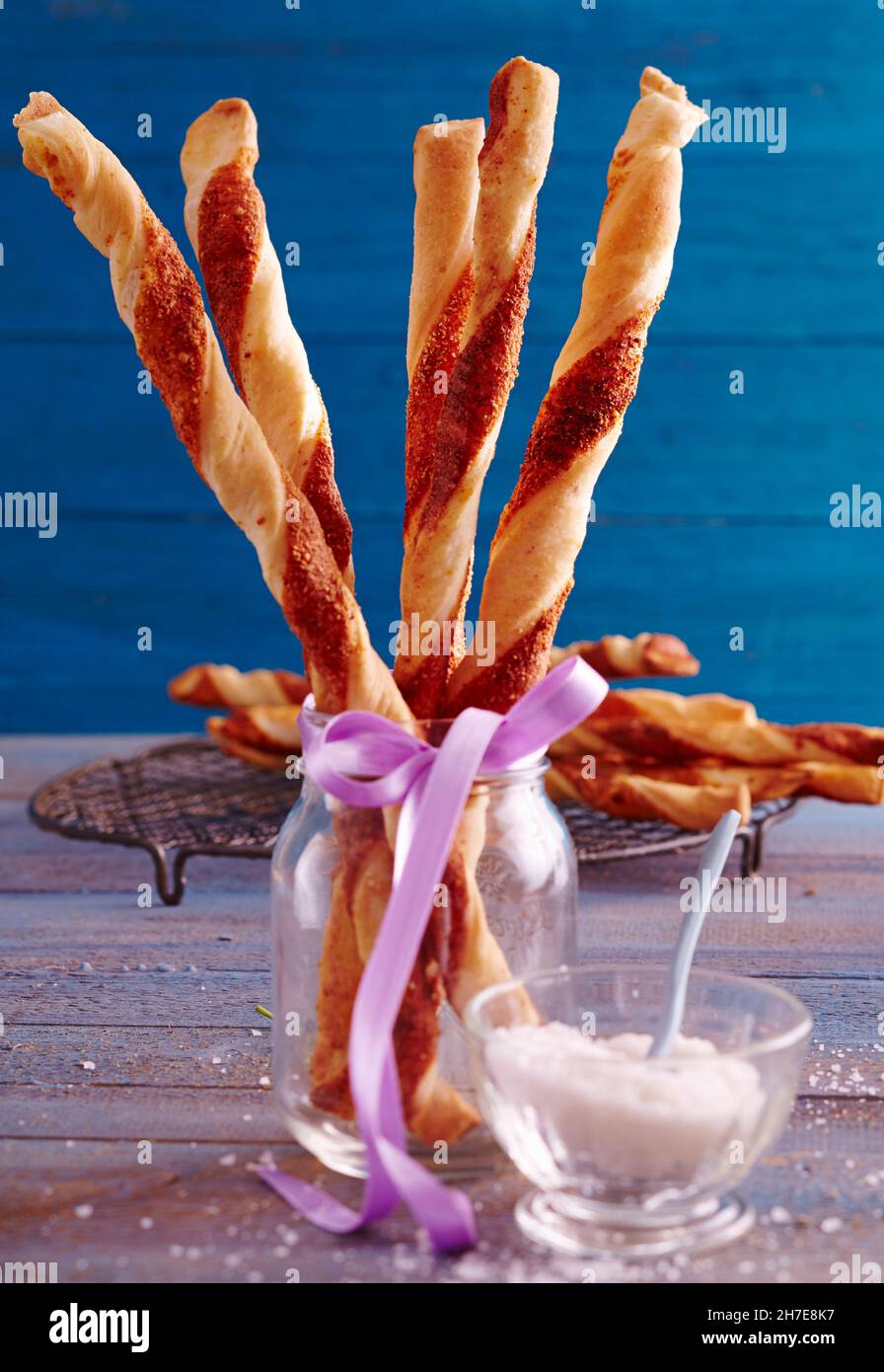 Spicy yeast dough and puff pastry Parmesan sticks in a glass Stock ...