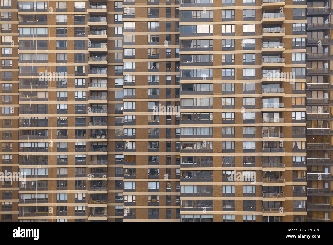Group of tall minimalistic buildings with lines windows Stock Photo - Alamy