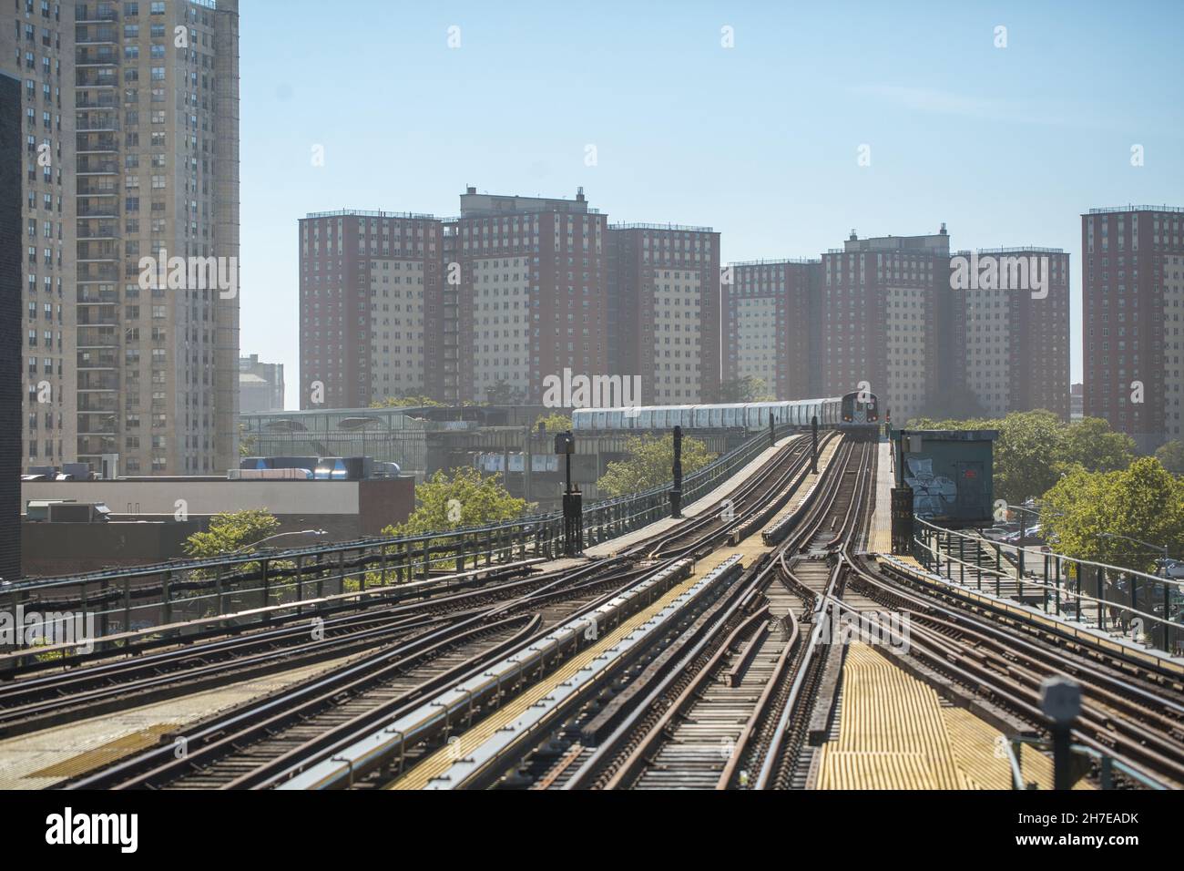 Aerial view of a railway track surrounded by tall buildings Stock Photo ...