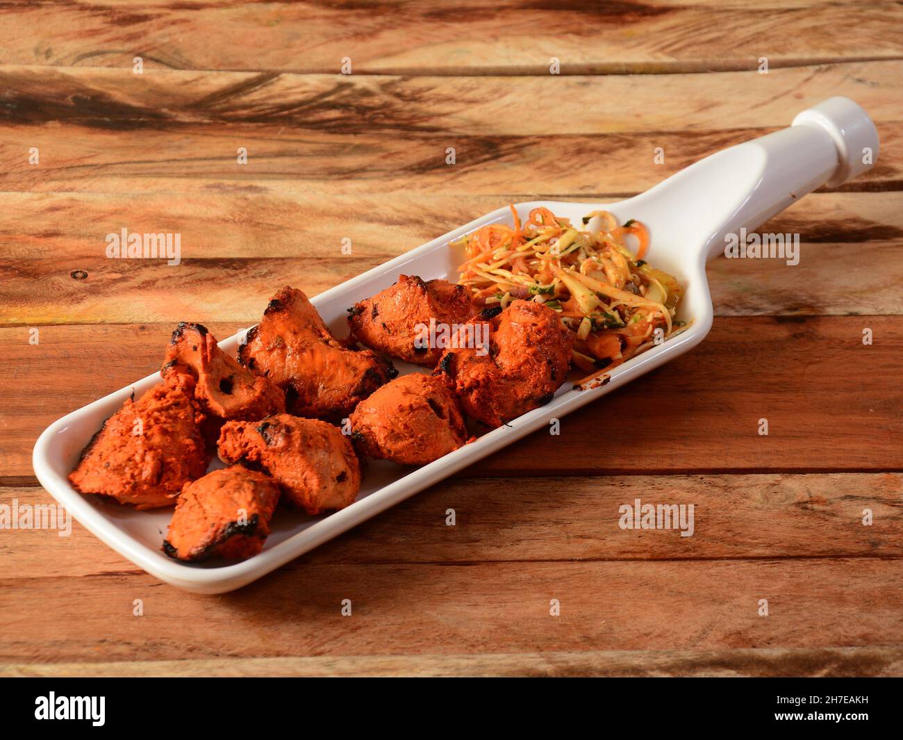 Assorted indian food Chicken Tikka kebab served on rustic wooden ...