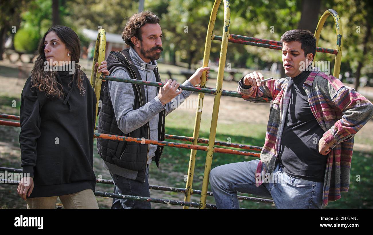 Group of young friends, female and male, smoking cannabis marijuana ...