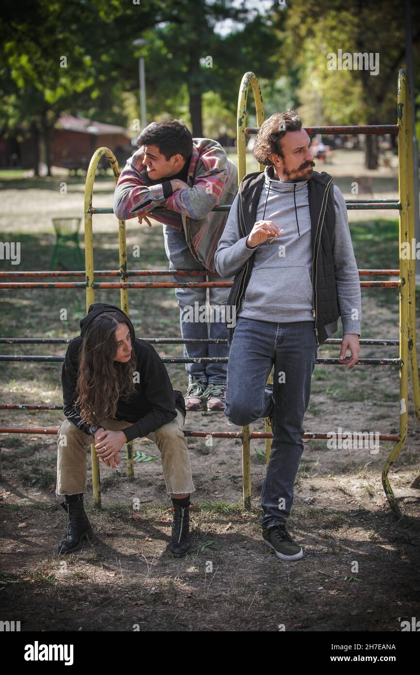 Group of young friends, female and male, smoking cannabis marijuana ...