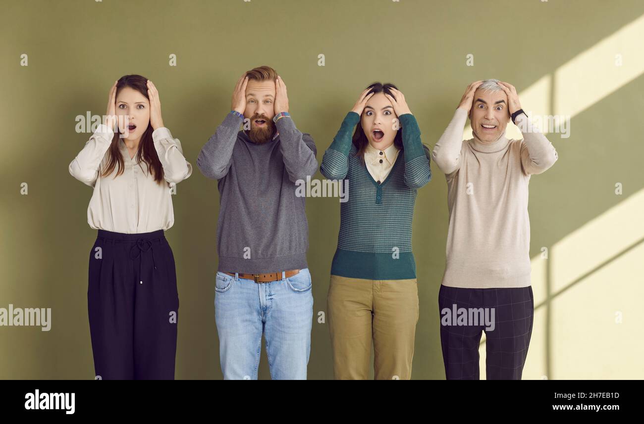 Group of four people panicking because of something scary, shocking and ...
