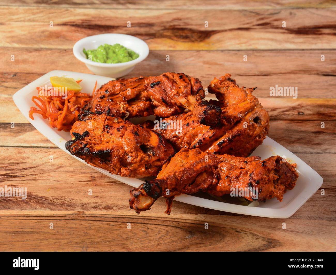 Tandoori chicken - prepared by roasting chicken marinated in yoghurt ...
