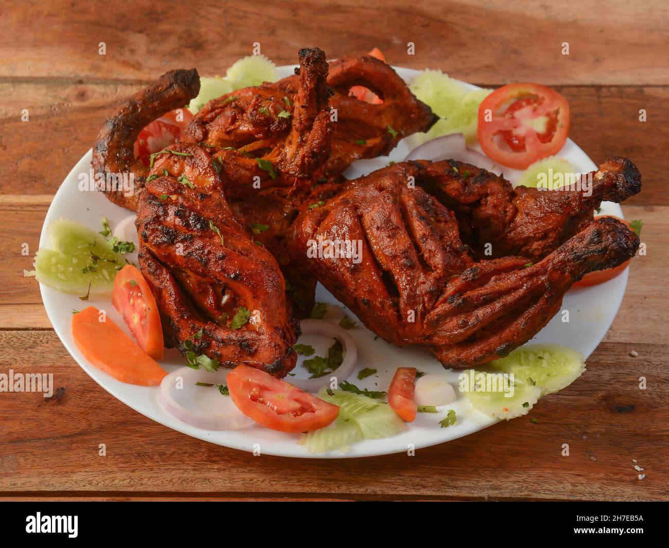 Tandoori chicken - prepared by roasting chicken marinated in yoghurt ...