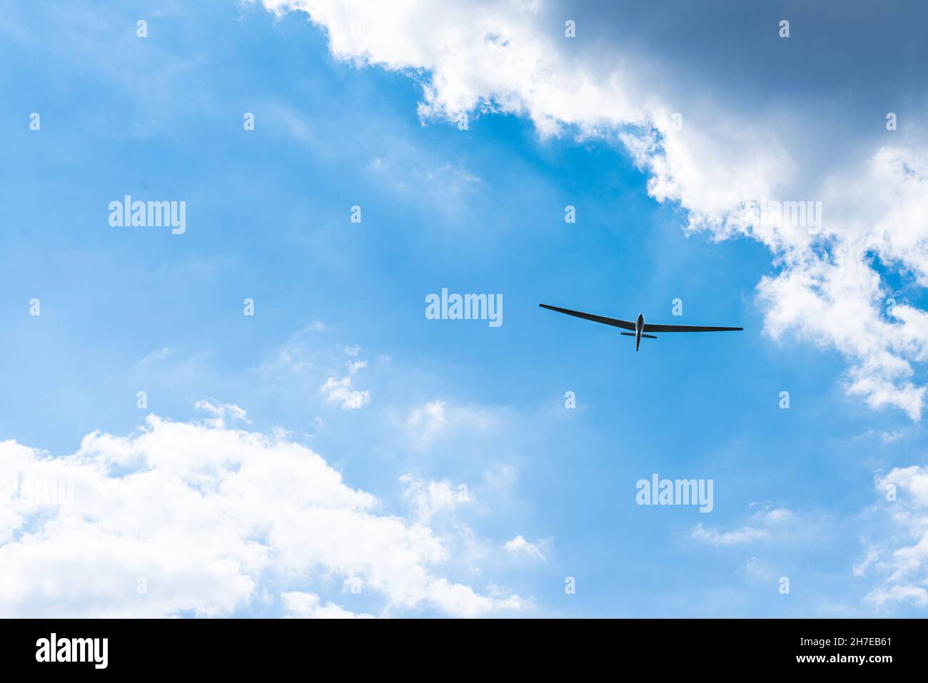 Glider flies through blue hi-res stock photography and images - Alamy