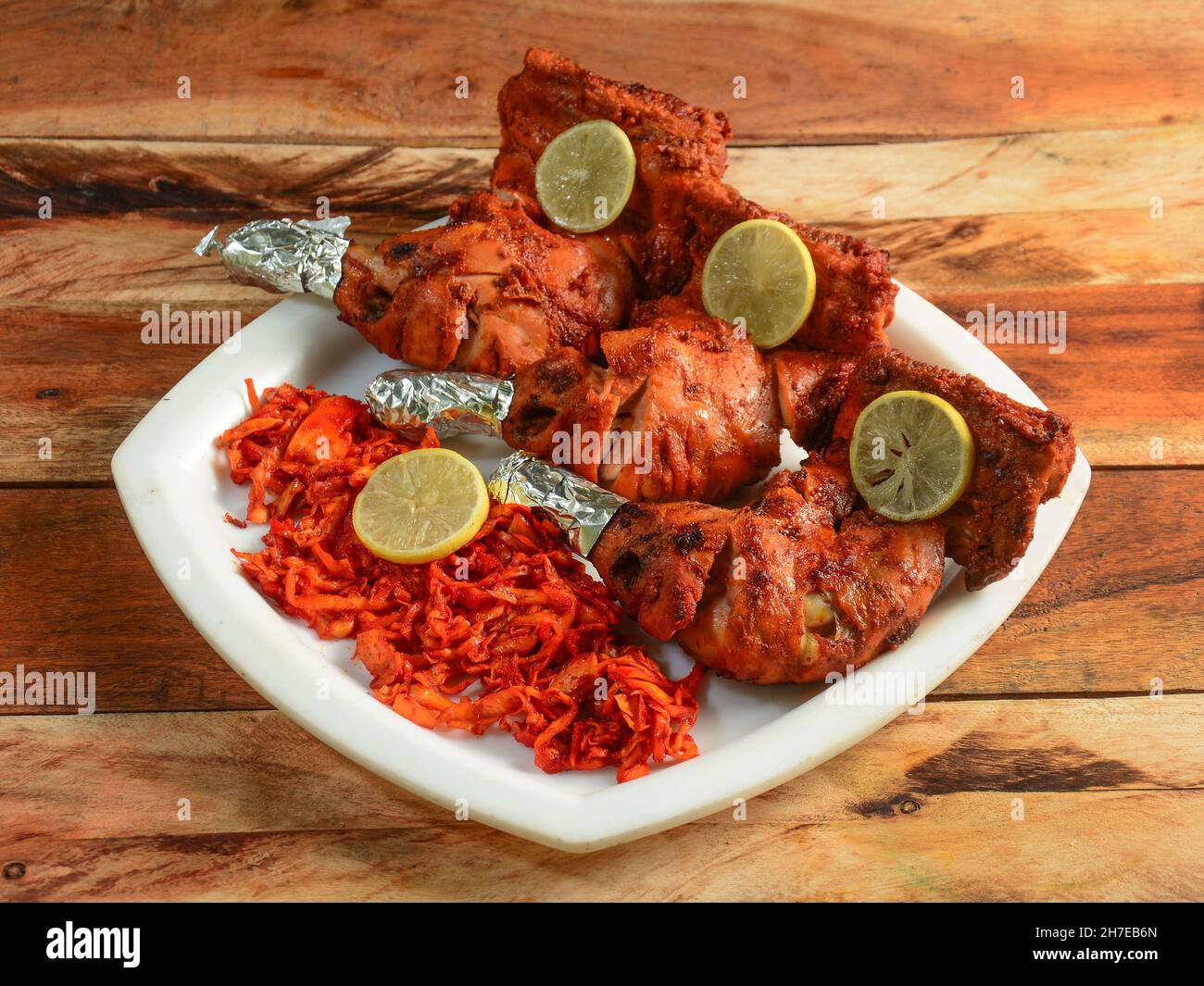 Tandoori chicken - prepared by roasting chicken marinated in yoghurt ...