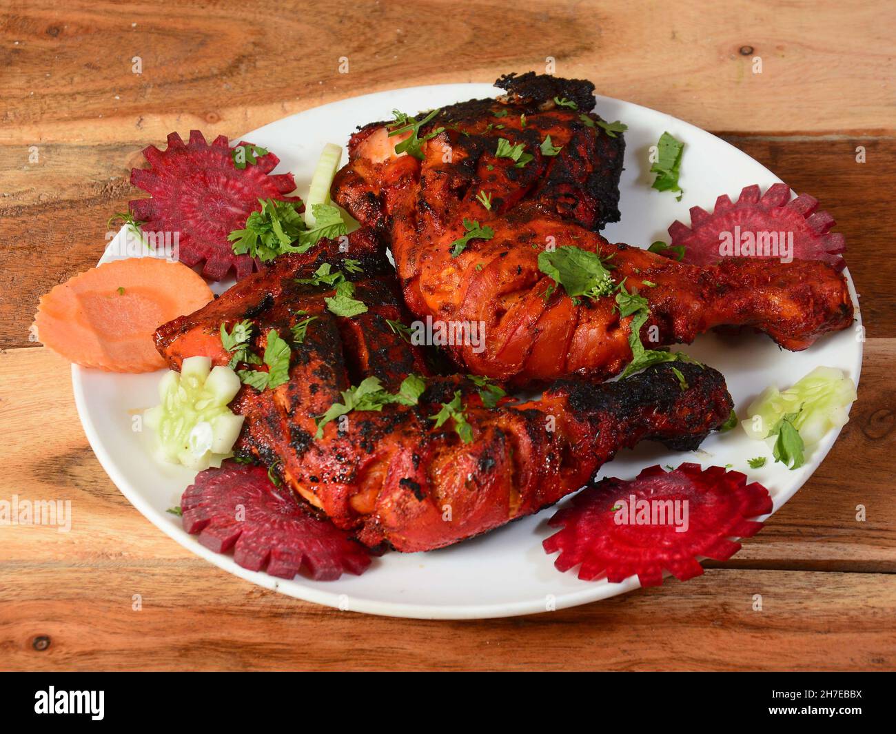 Tandoori chicken - prepared by roasting chicken marinated in yoghurt ...
