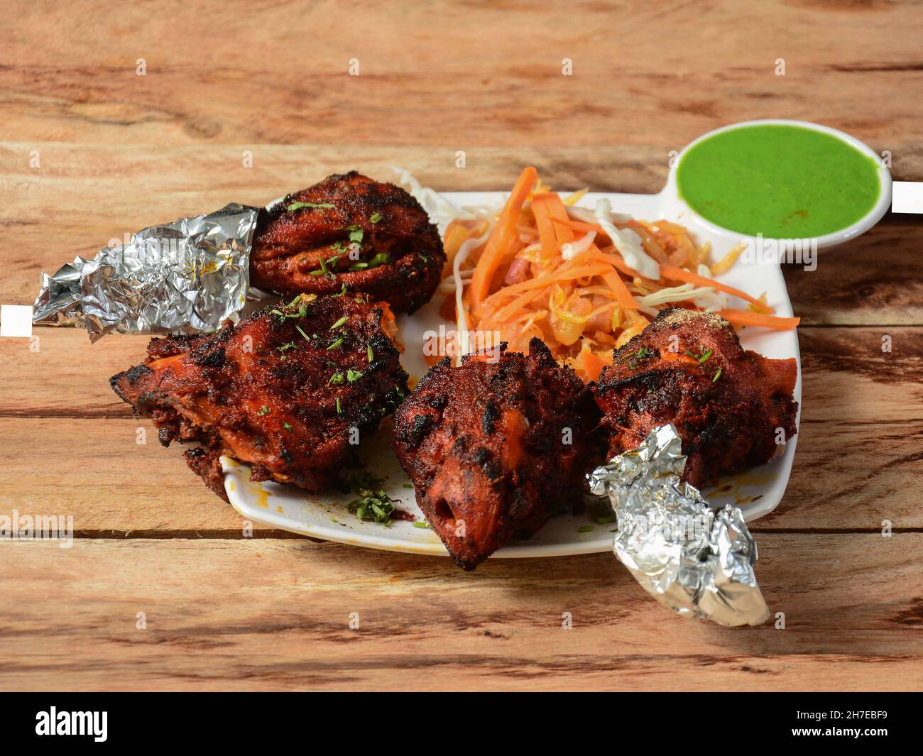 Tandoori chicken - prepared by roasting chicken marinated in yoghurt ...