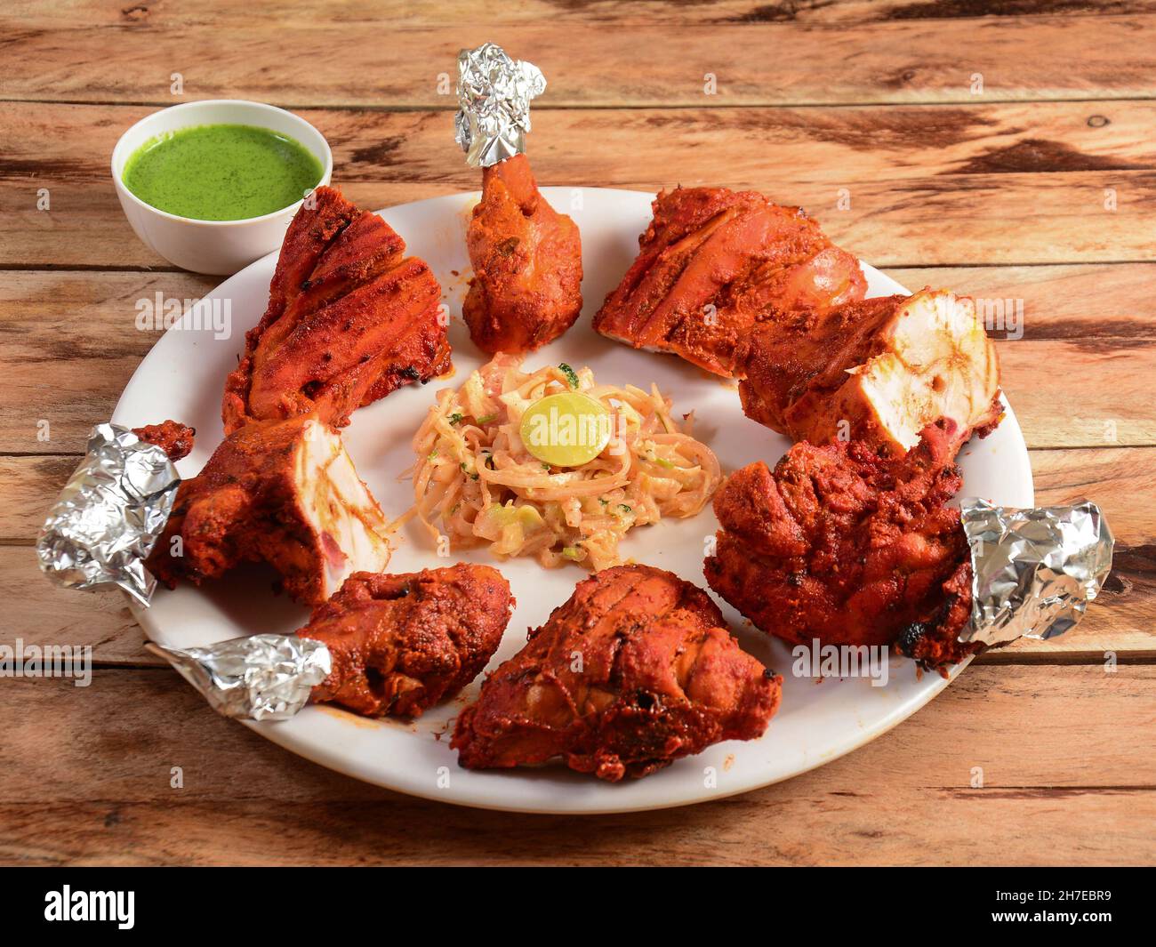 Tandoori chicken - prepared by roasting chicken marinated in yoghurt ...