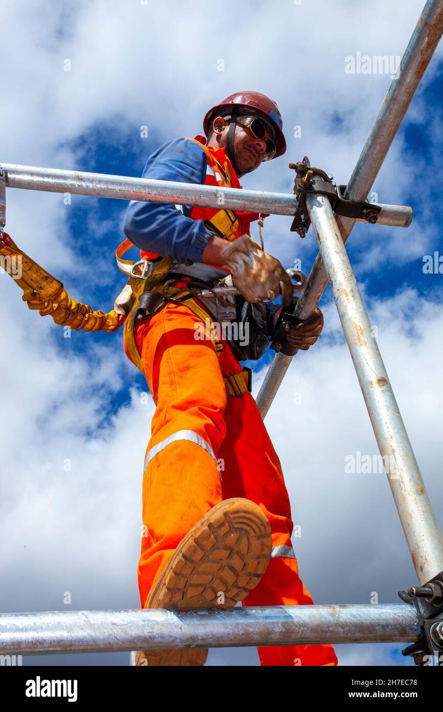 construction worker on a scaffold Stock Photo - Alamy