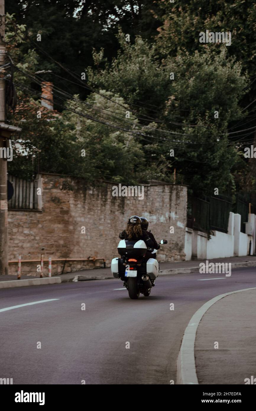 IASI, ROMANIA - Sep 15, 2021: A vertical shot of a couple riding a ...