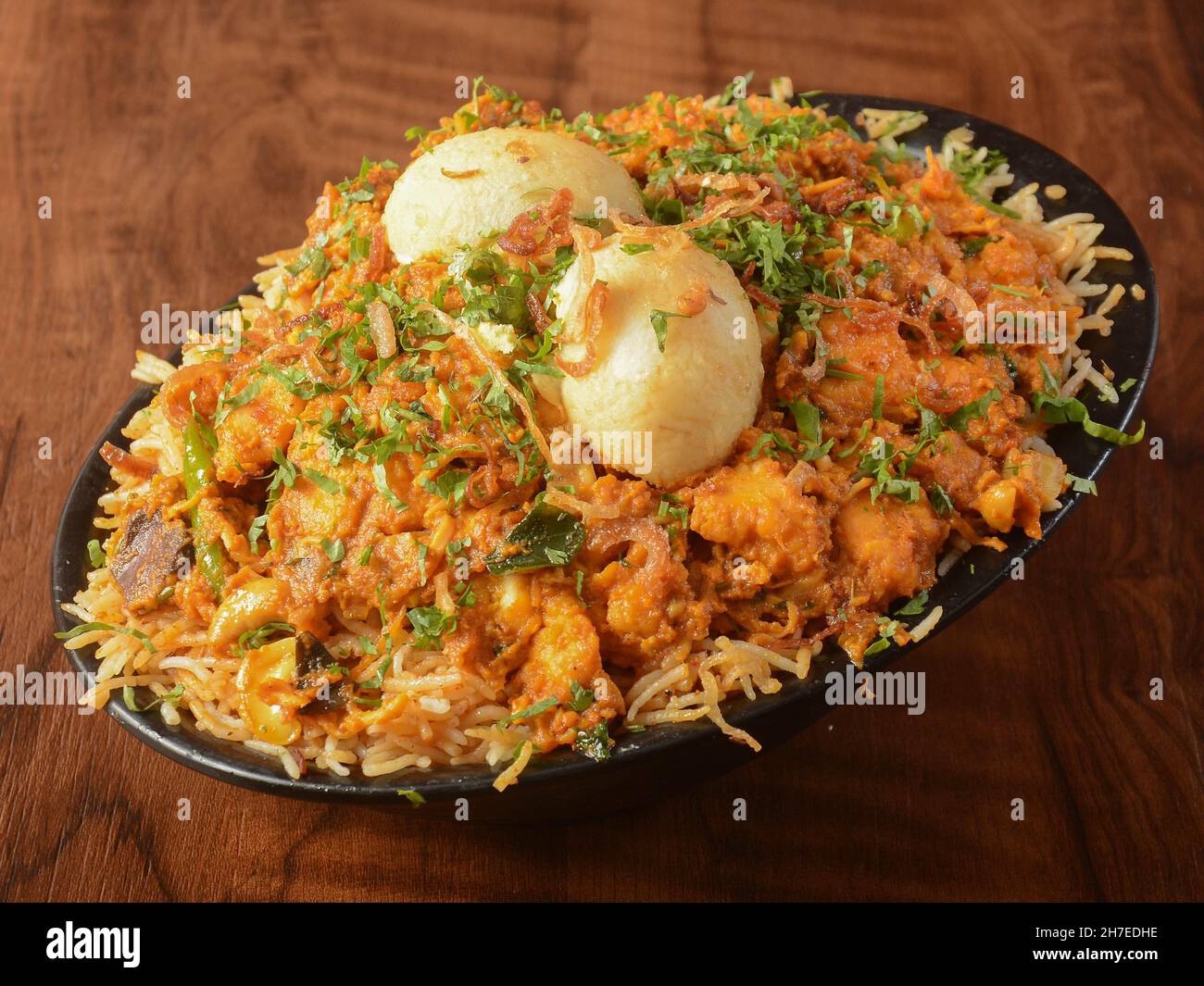 Traditional Mughal Chicken Biryani made of Basmati rice cooked with ...