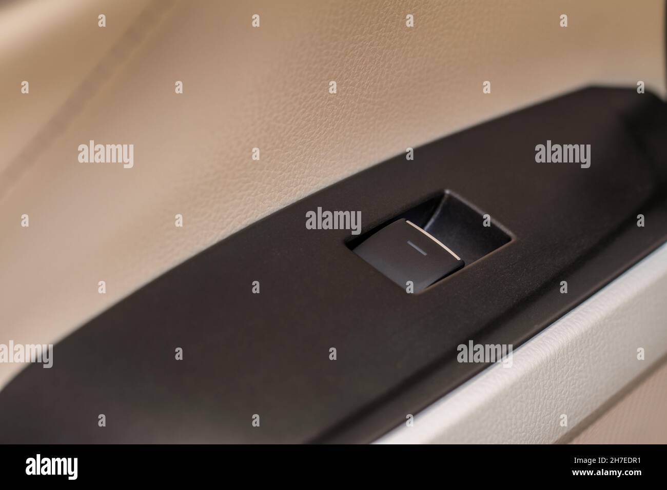 Close up view of button controlling window in modern car interior ...