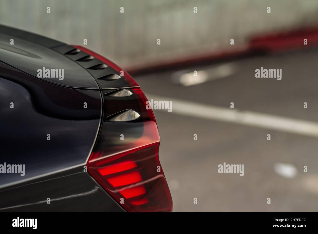 Modern rear light of a car. Brake light and arrow of large suv. Rear ...