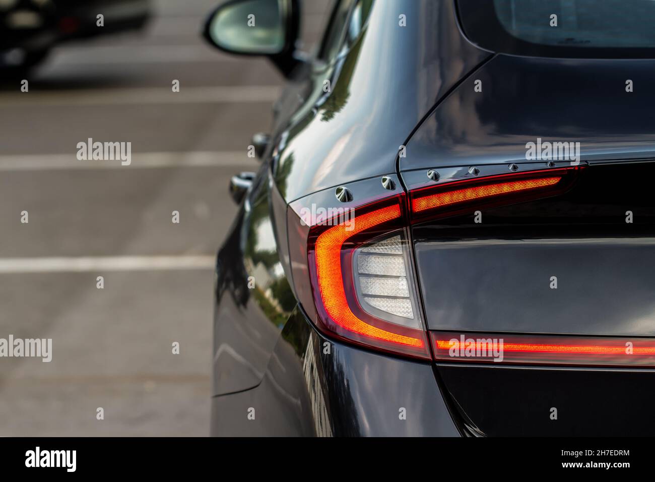 Modern rear light of a car. Brake light and arrow of large suv. Rear ...