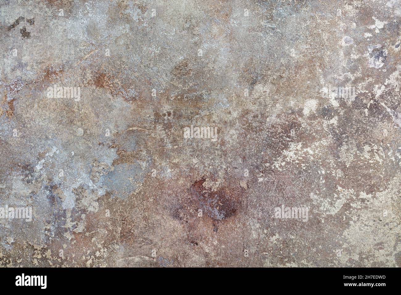 The mottled texture of canvas and old plaster in beige, brown and gray ...