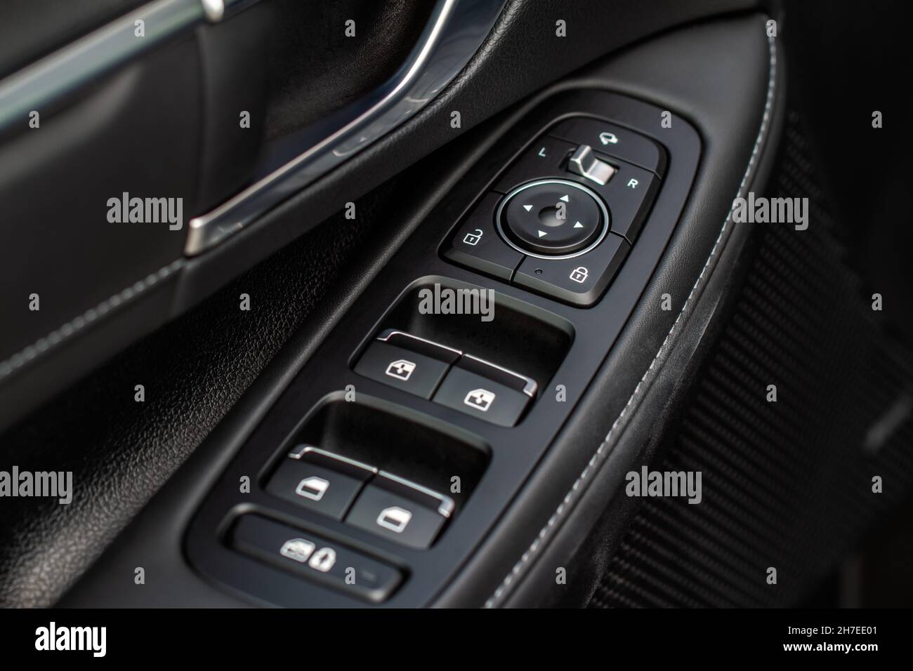 Close up view of button controlling window in modern car interior ...
