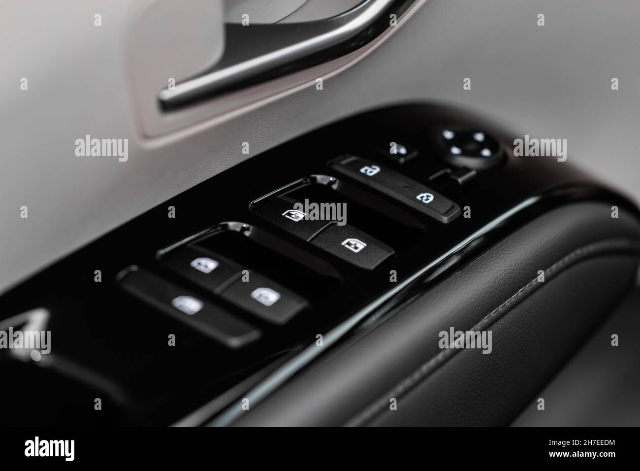 Close up view of button controlling window in modern car interior ...