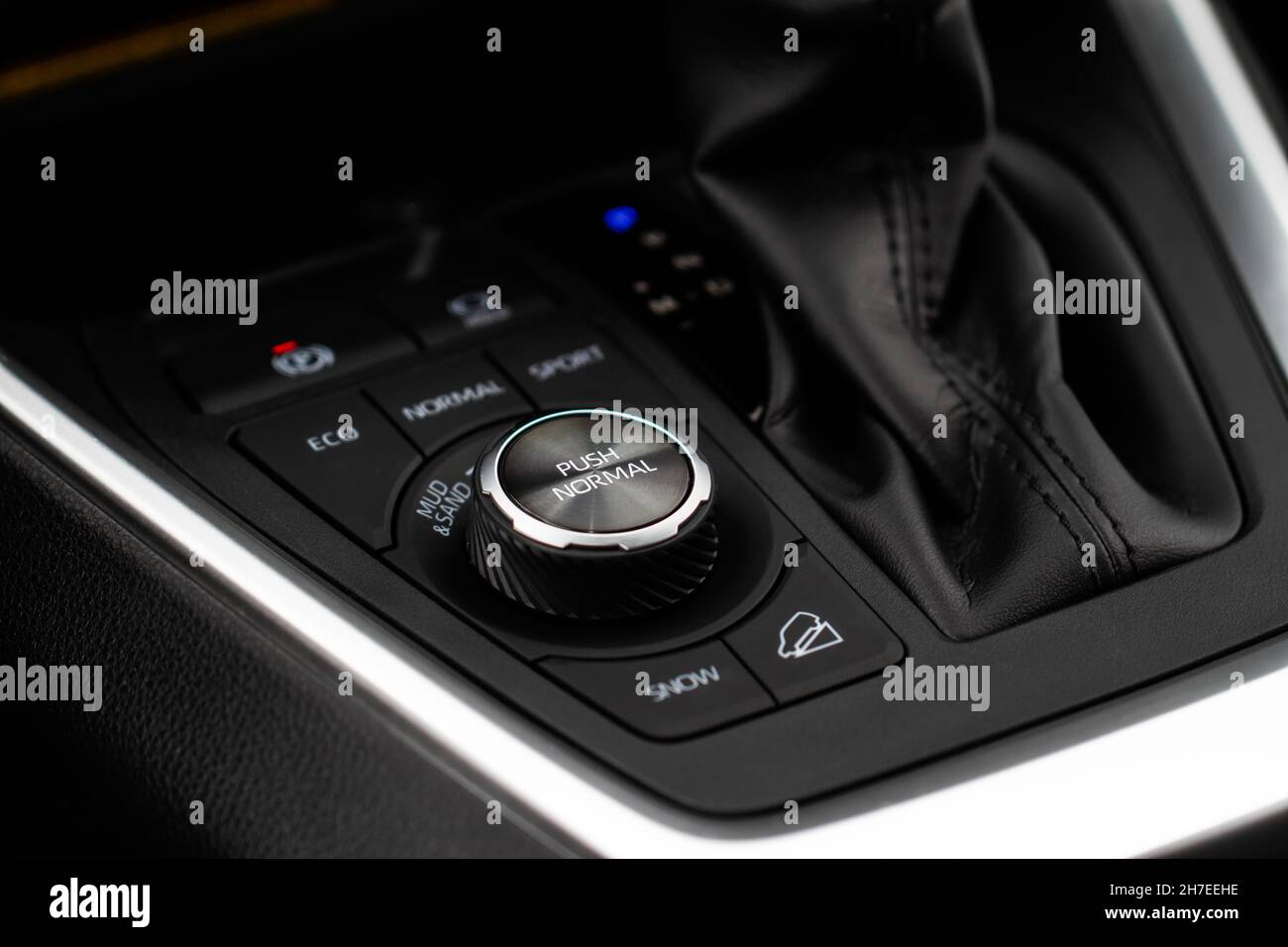 Modern car drive mode selector. Suspension and wheel drive control ...