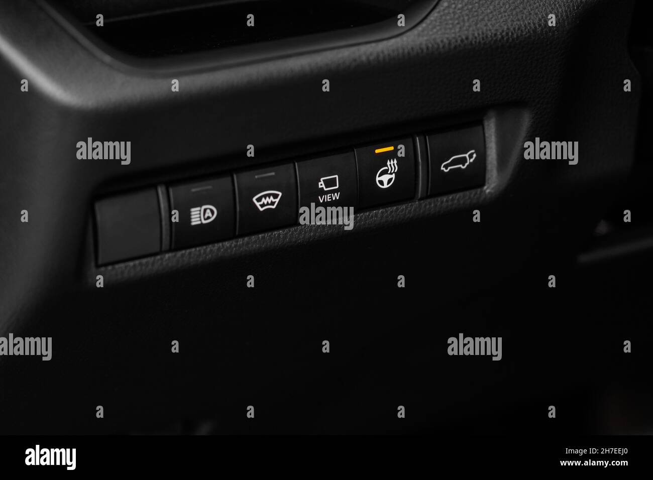 Close up of Heated steering wheel switch on. Steering wheel heating ...