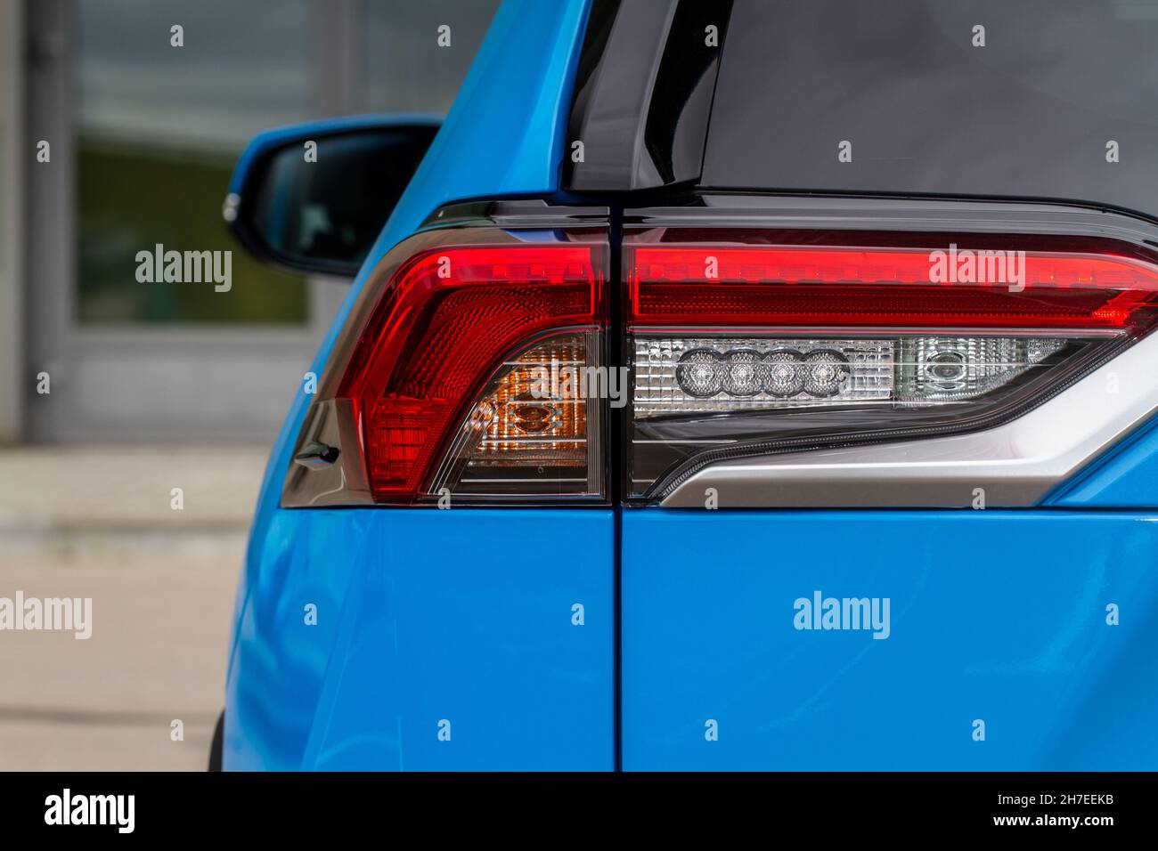 Modern rear light of a car. Brake light and arrow of large suv. Rear ...