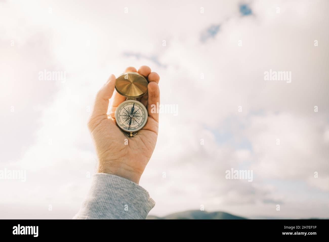 Vintage compass in hand hi-res stock photography and images - Alamy