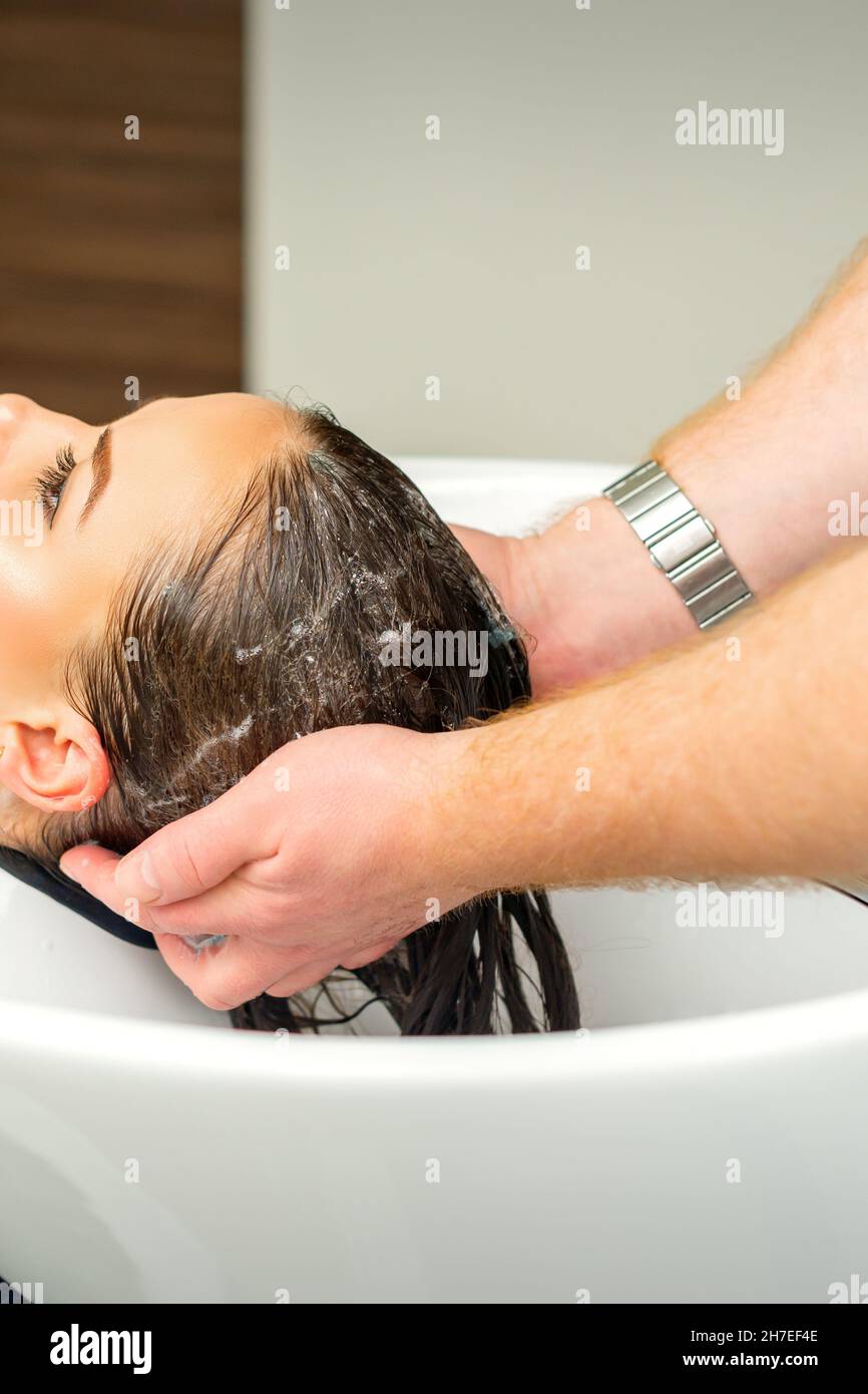 Beautiful caucasian woman washing hair in a beauty salon Stock Photo ...