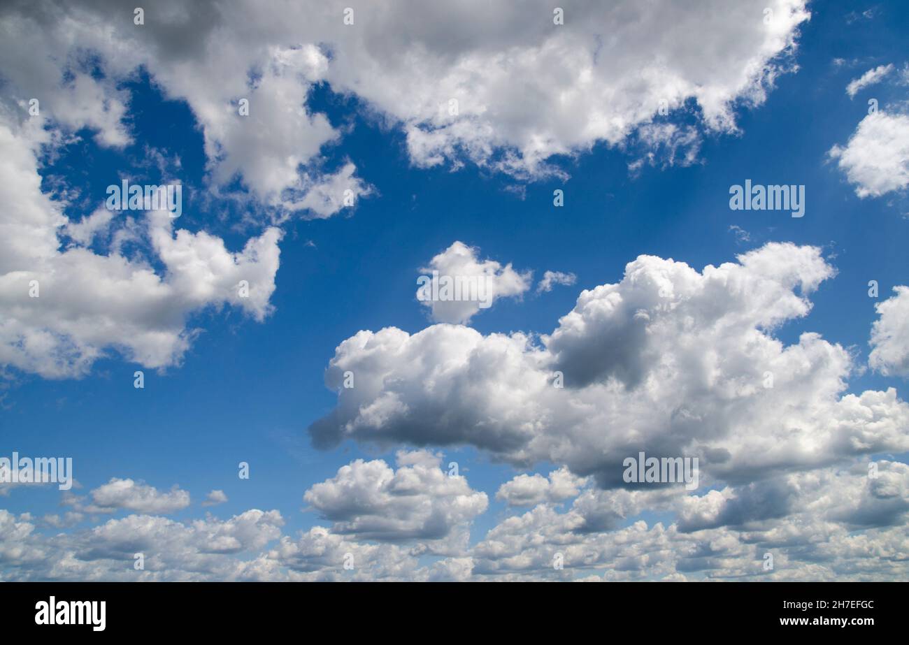 Heavy clouds in the deep blue summer sky natural wallpaper background ...