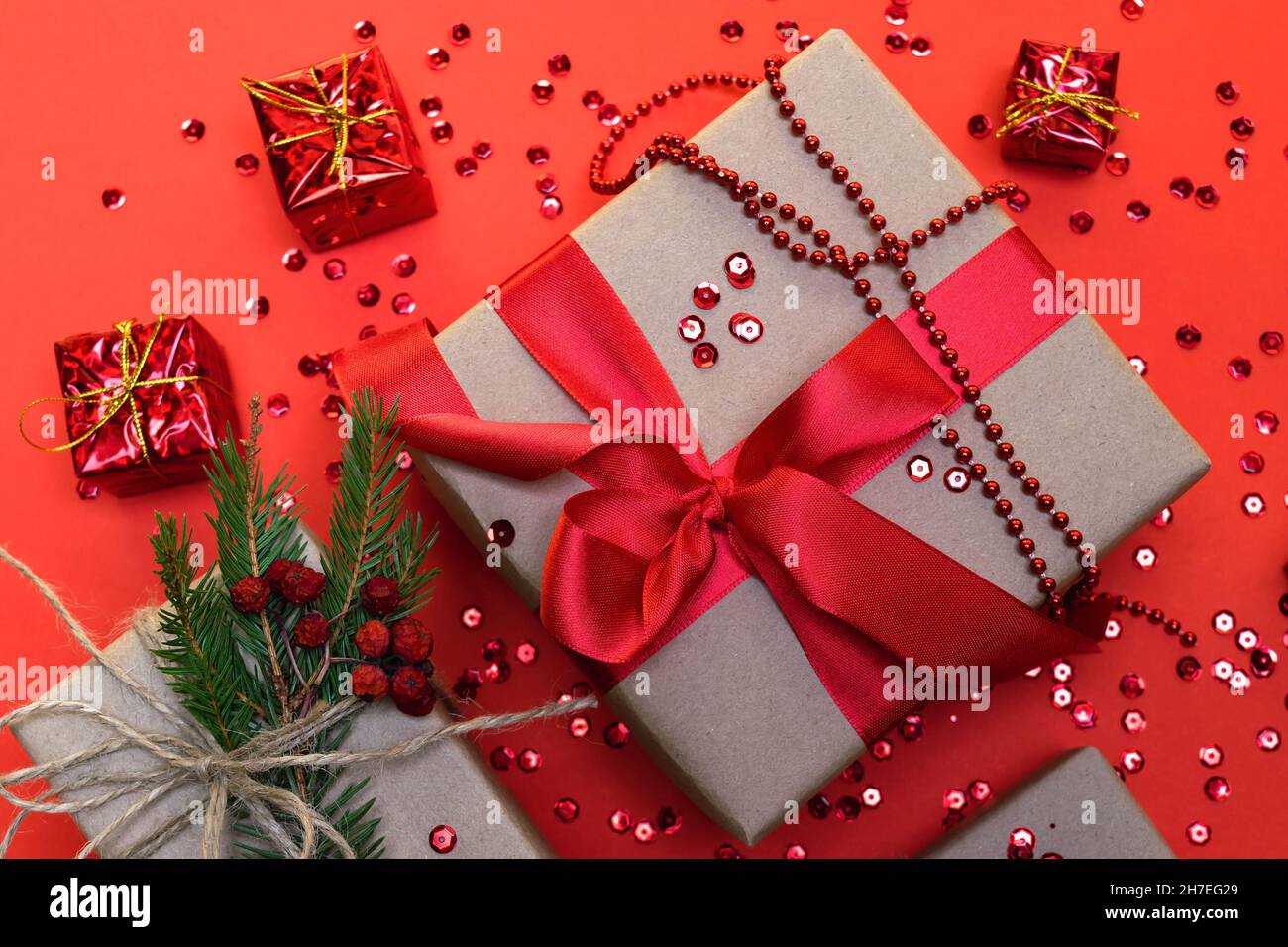 Bright red Christmas decorations and Christmas gifts on a red ...