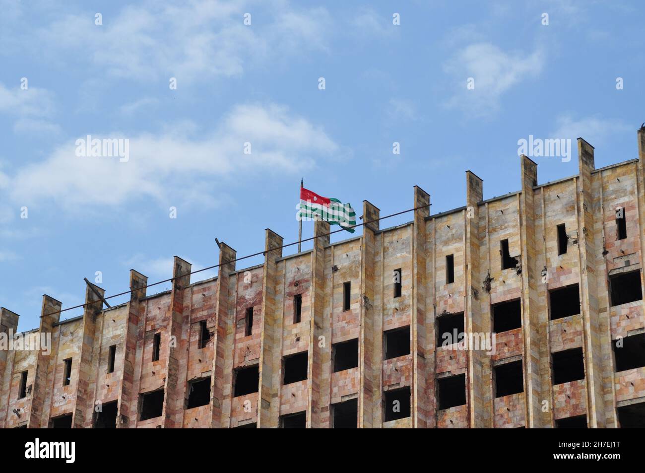 Flag on top of the abandoned Abkhazian Parliament Building in Sukhumi ...