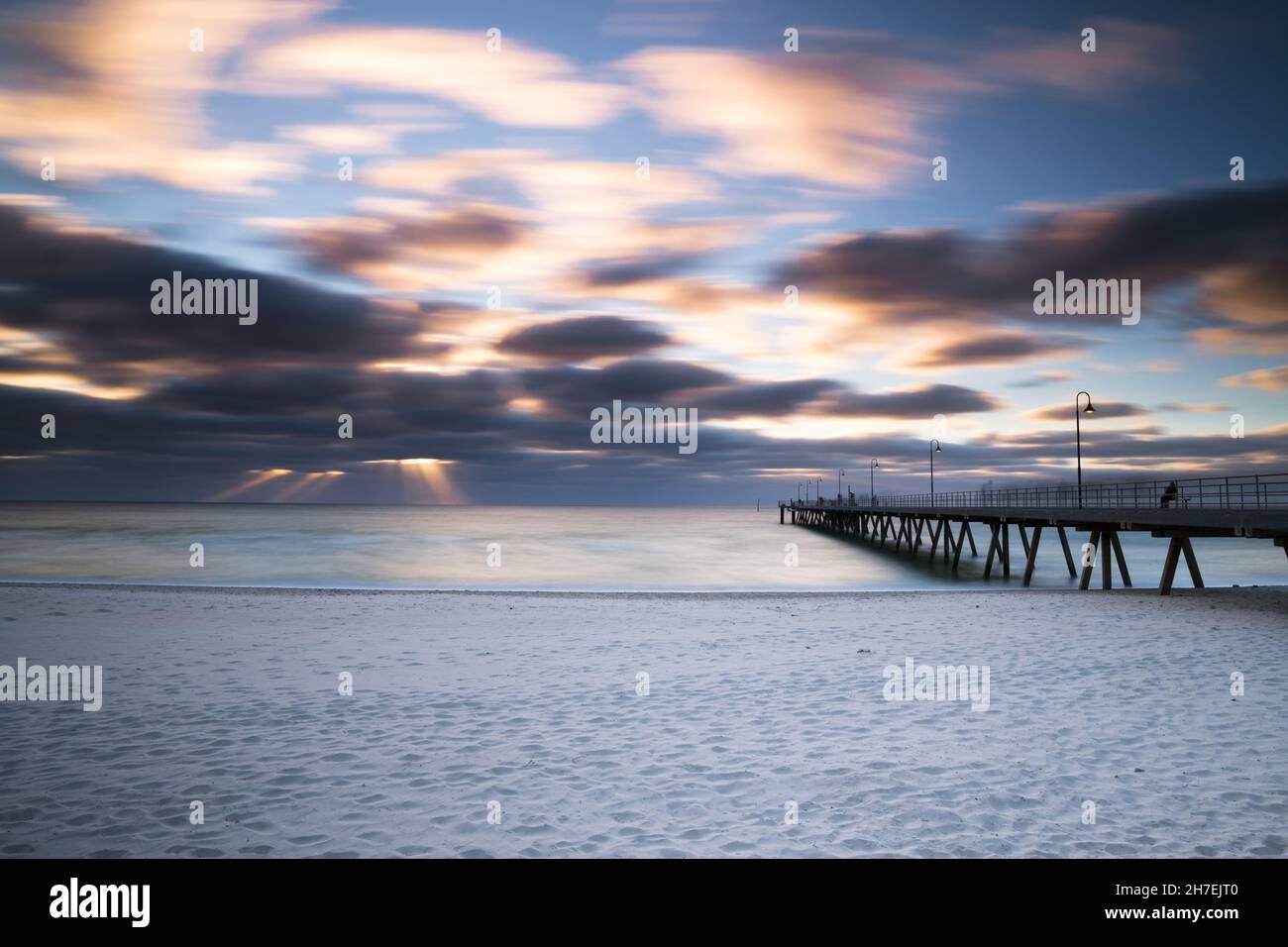 Scenic view of a bridge over the ocean on a sunset sky background Stock ...