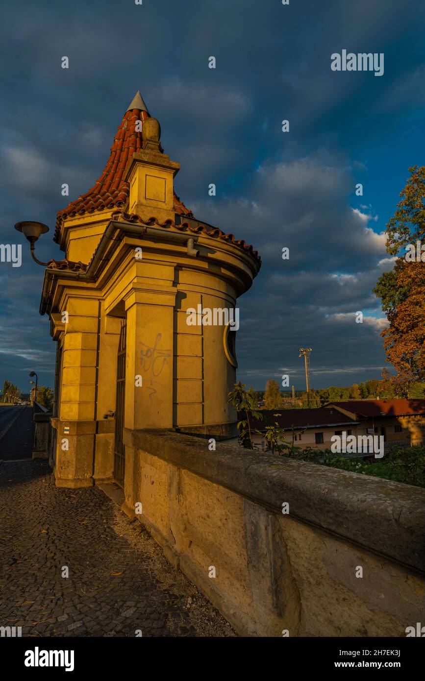 Orange sunset in Roudnice nad Labem town with old church and towers ...