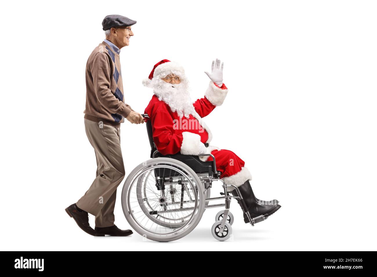 Full length profile shot of an elderly man pushing santa claus in a ...
