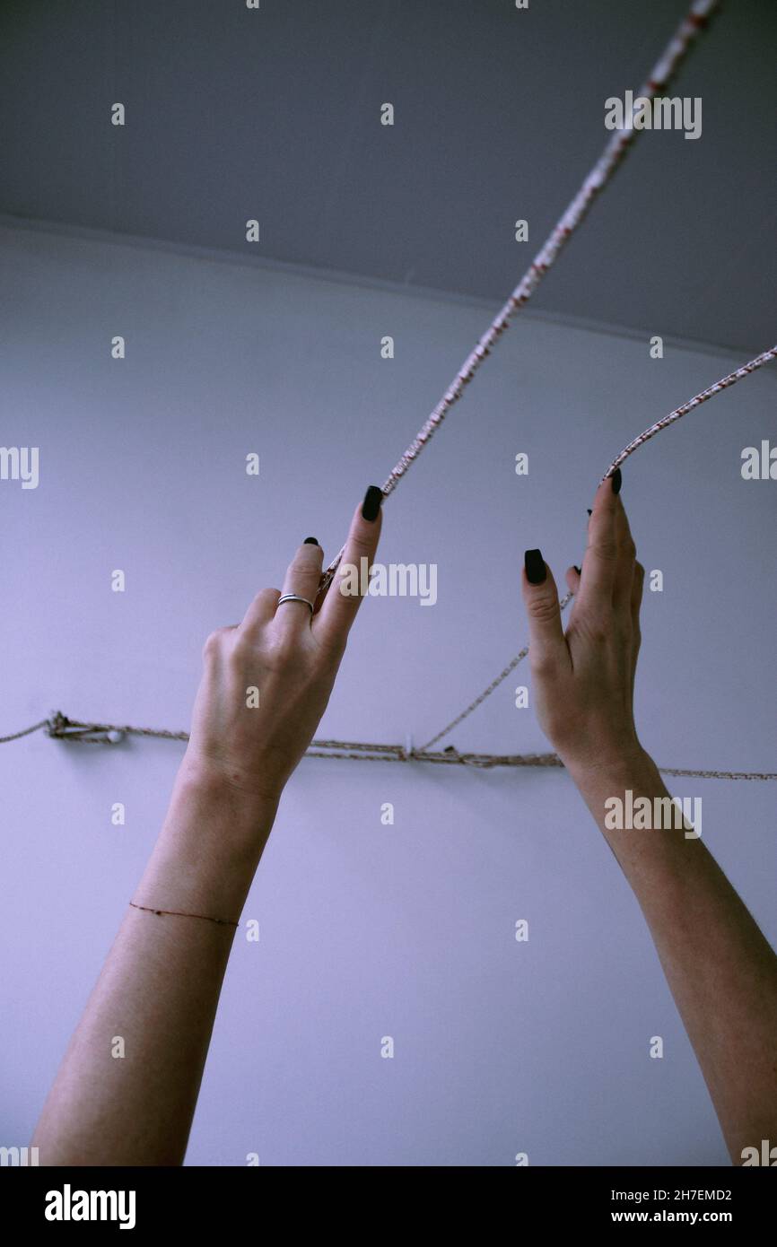Hands holding rope hi-res stock photography and images - Alamy