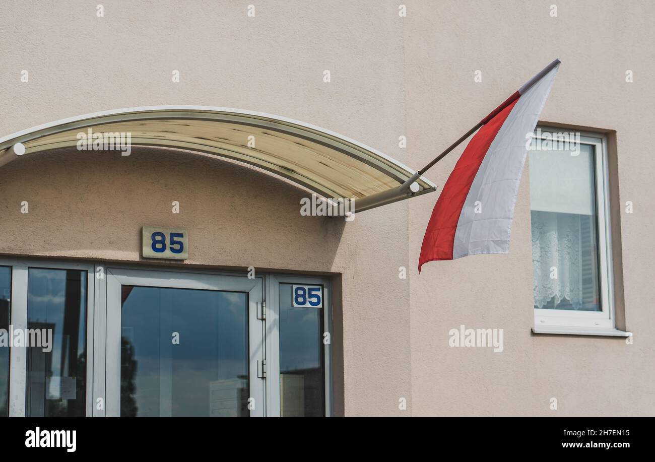 POZNAN, POLAND - Jun 27, 2018: A Polish national flag hanging in front ...