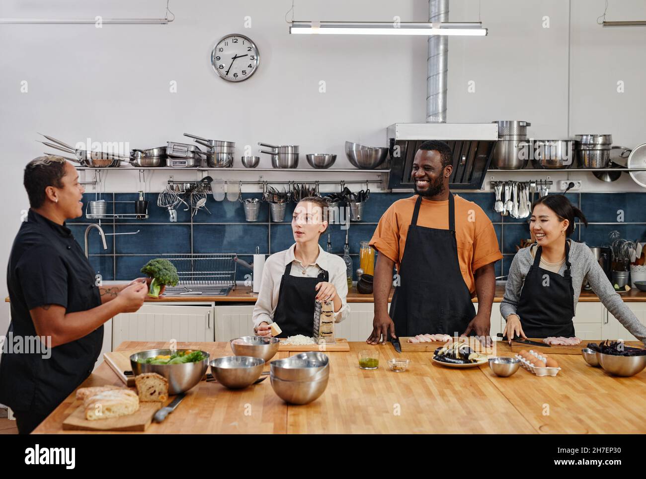 Diverse male chef instructing group hi-res stock photography and images ...