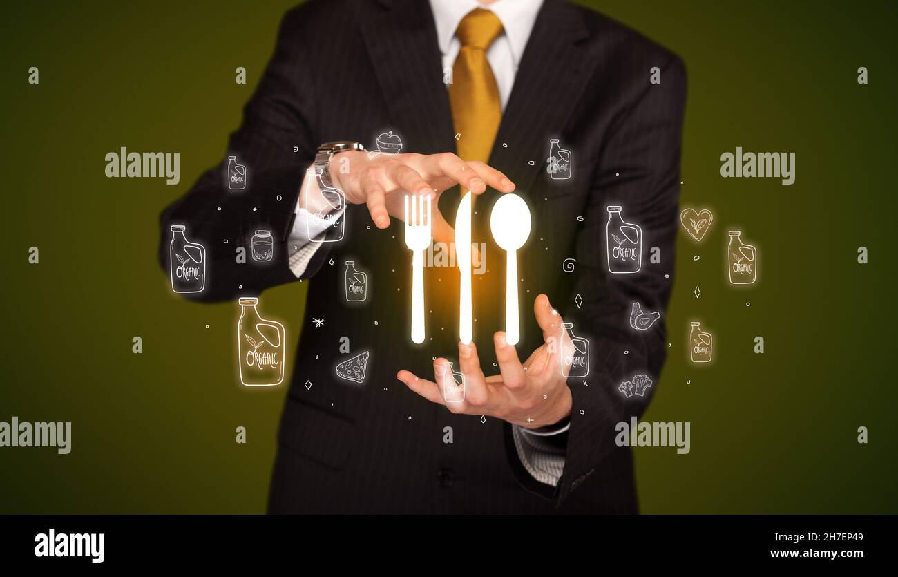 Hand holding food related icons Stock Photo - Alamy