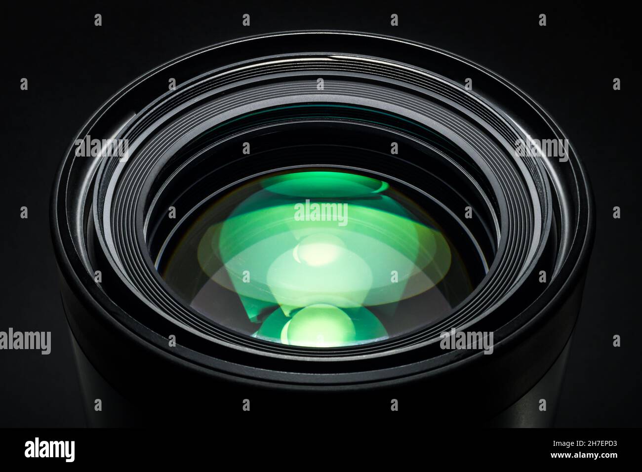 Camera lens with beautiful green optical highlights. Macro photography ...